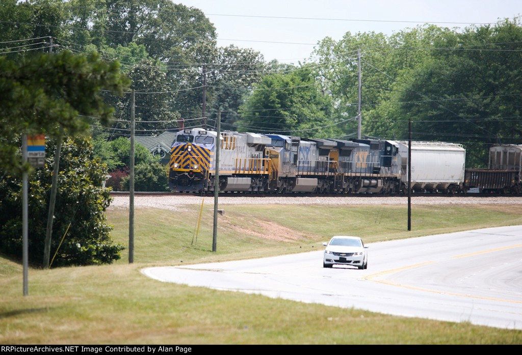 CREX ES44AC 1516 leads CSX C40-8Ws 7796 and 7906